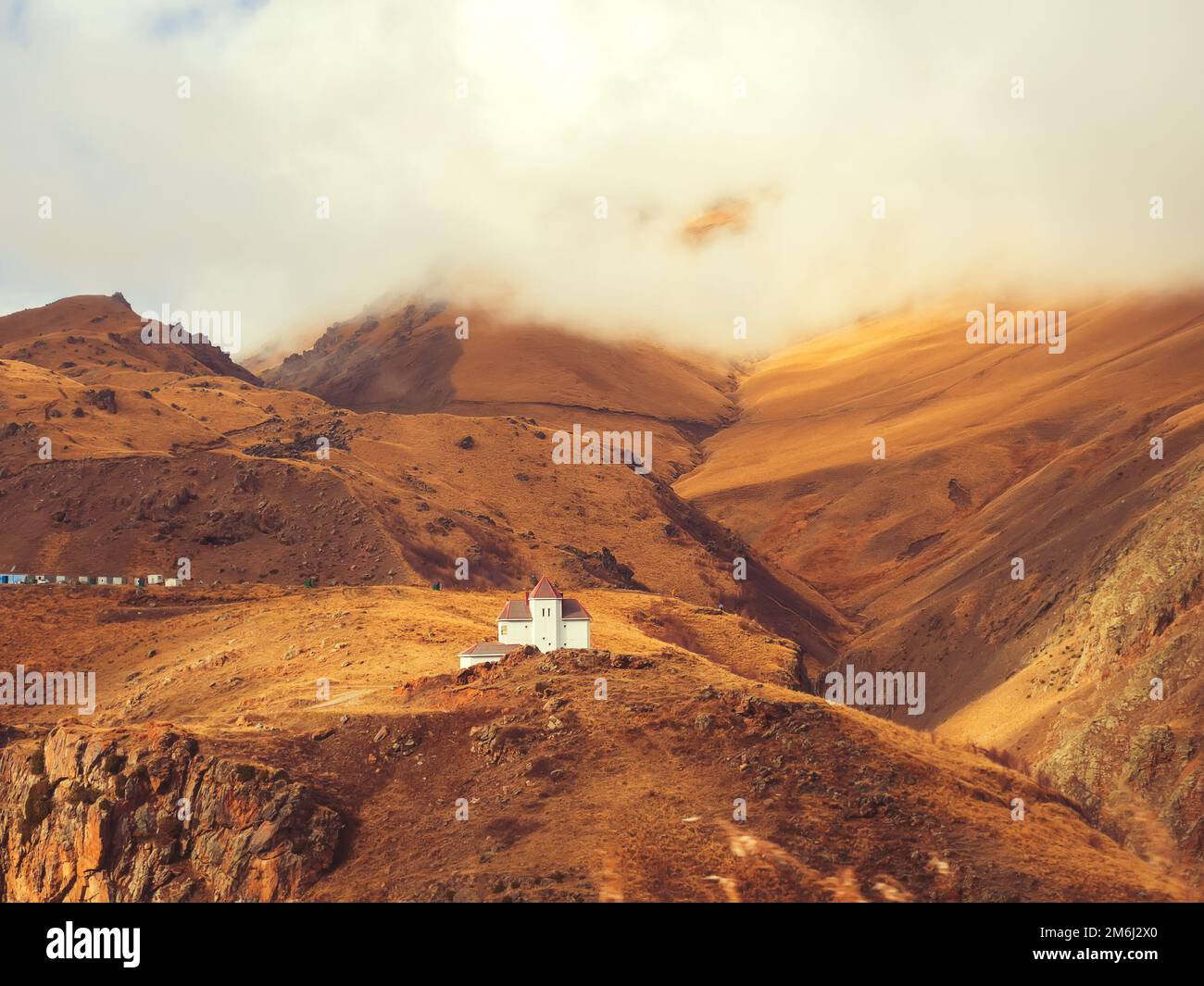 High in the mountains, among the clouds descending on the peaks, not ...