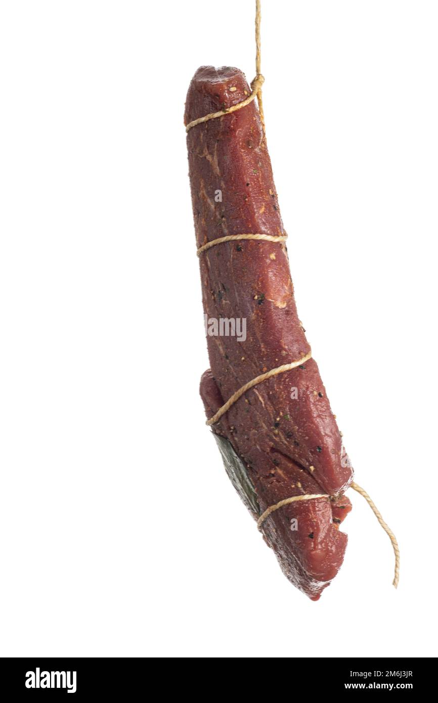 Hanging raw pork tenderloin on white Stock Photo - Alamy