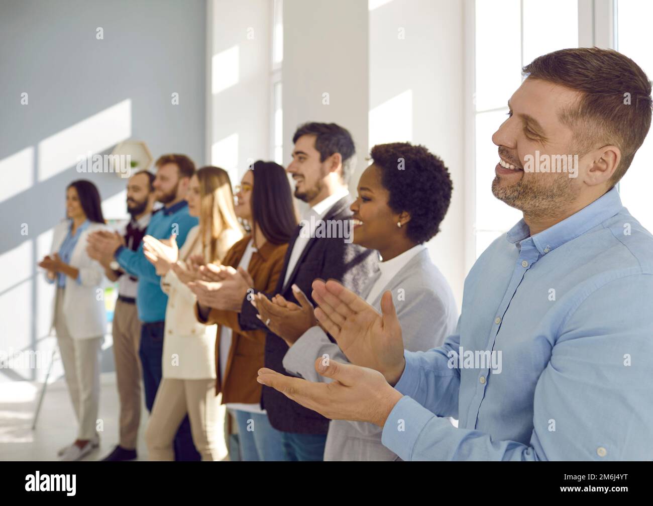 Smiling businesspeople clap hands thanking for business meeting Stock ...