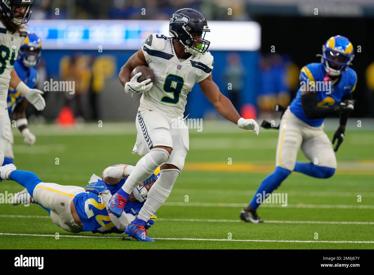 Seattle Seahawks running back Kenneth Walker III (9) avoids being ... Seattle Seahawks running back Kenneth Walker III (9) avoids being ...