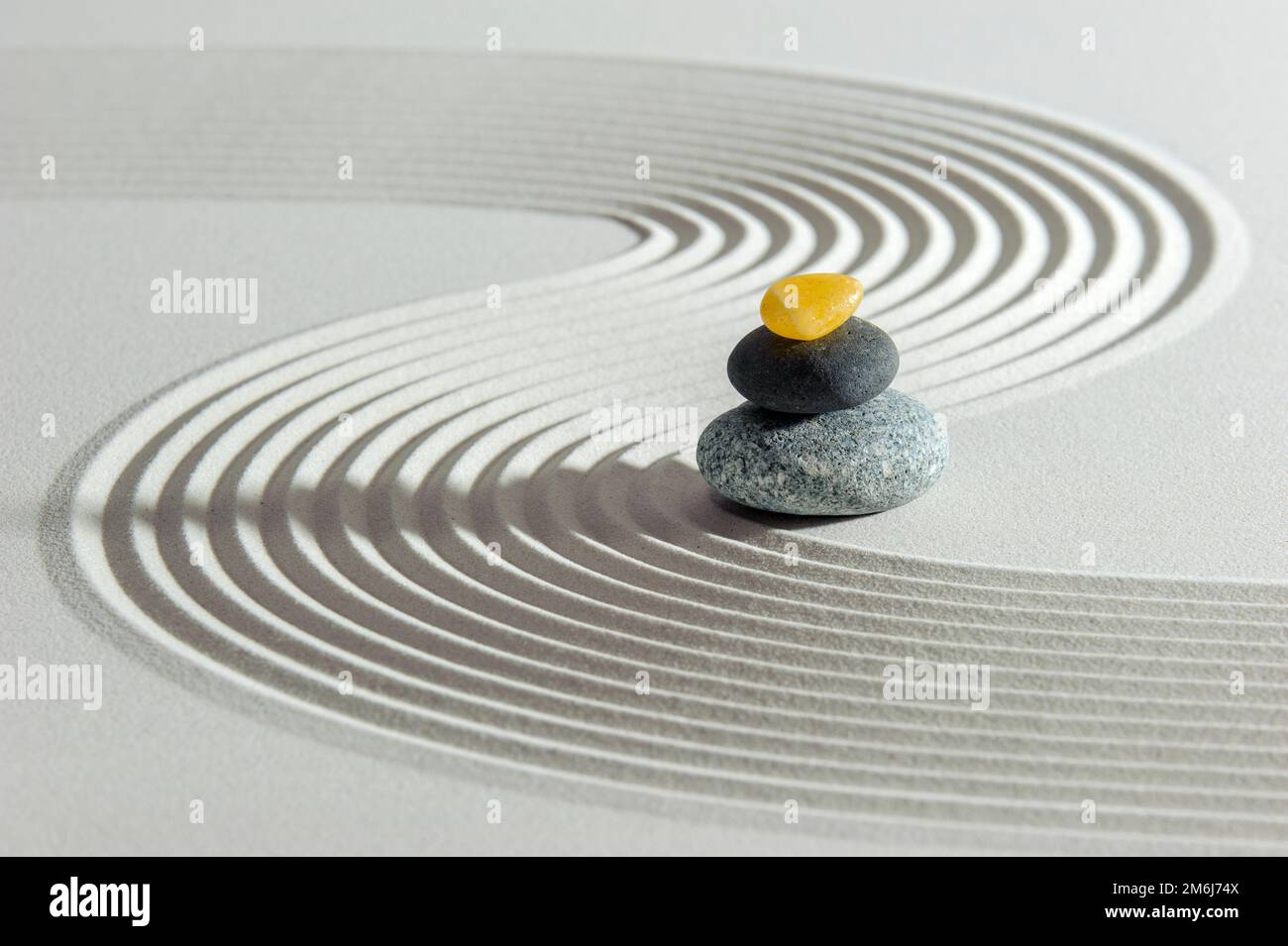 Japanese zen garden with yin and yang and feng shui in textured sand ...