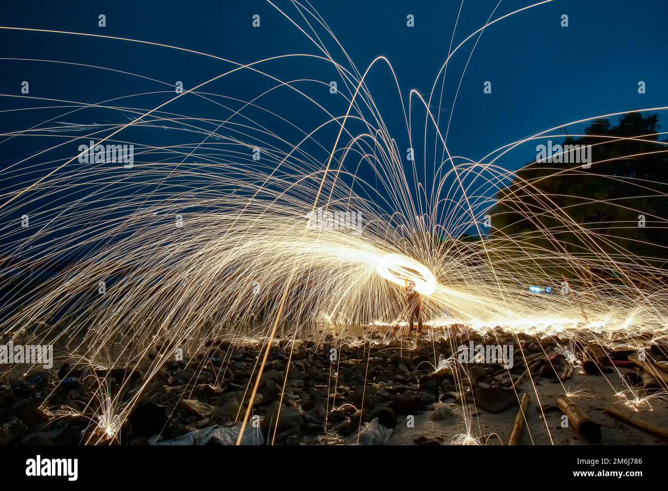 Playing with flames Holding a fire to cause flakes Stock Photo - Alamy