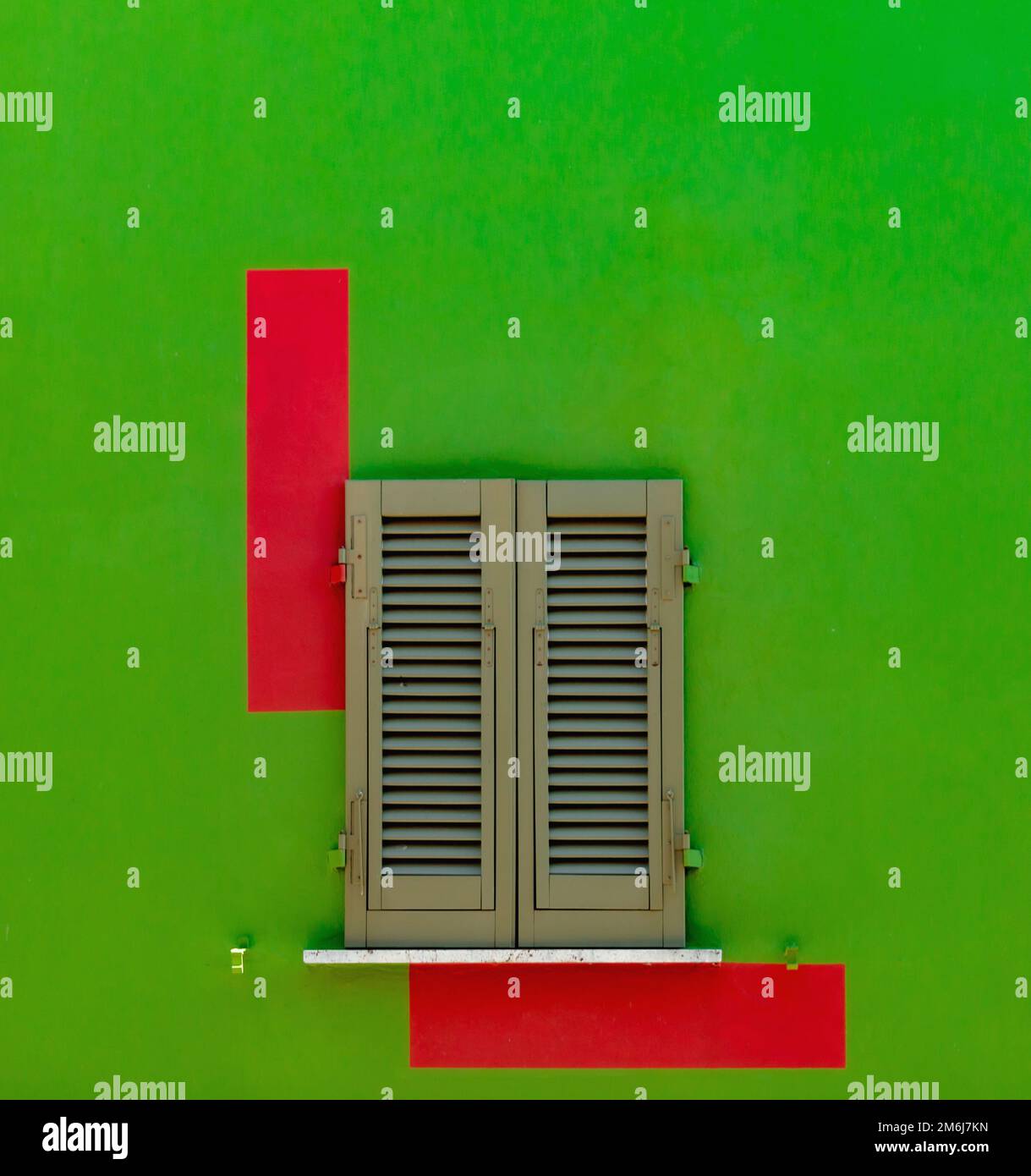 Minimalist view of a window in a bright colored wall Stock Photo - Alamy