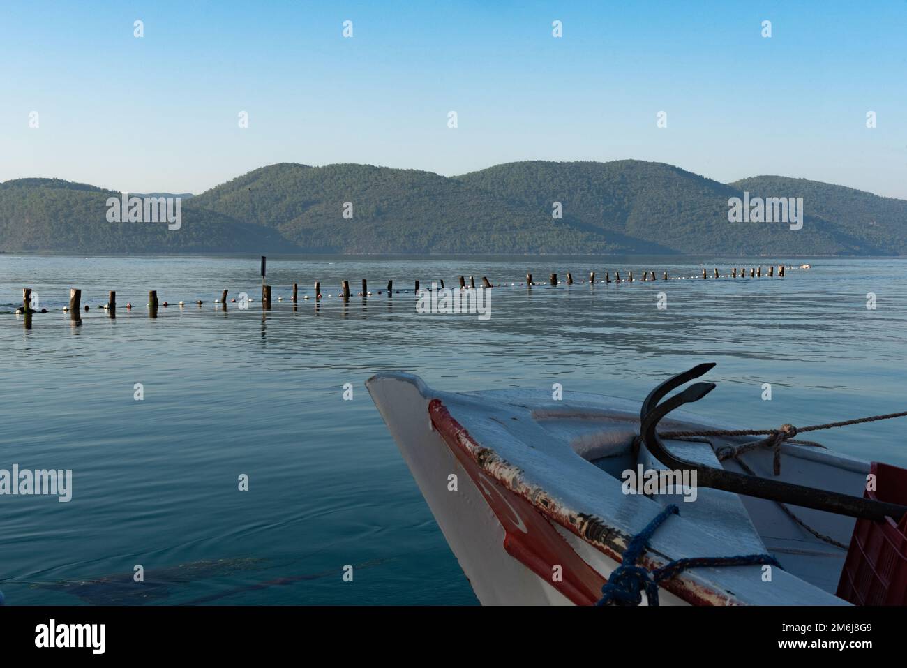 A boat moored in the beautiful harbour at the entrance to the Azmak ...