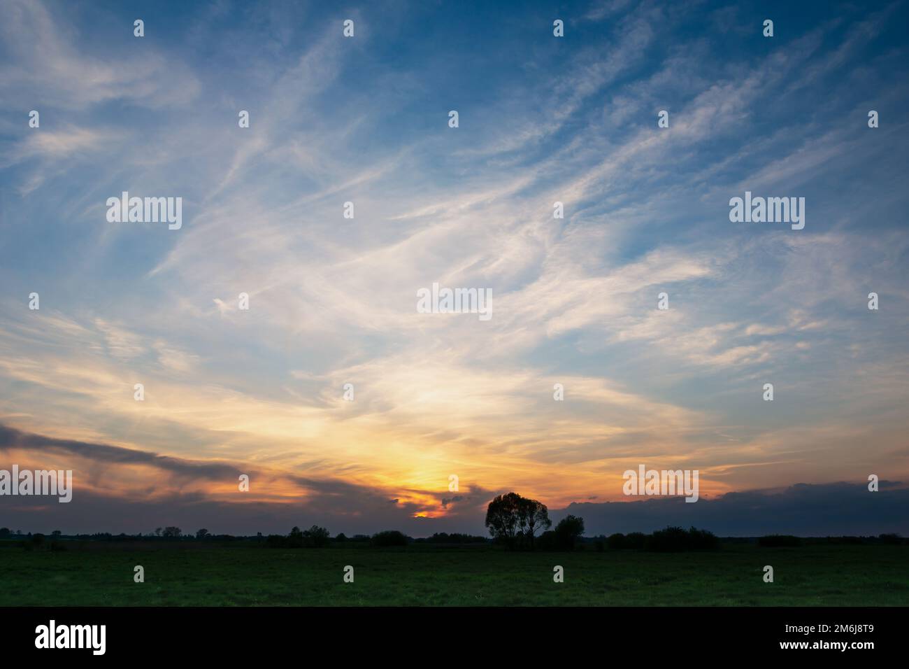 White clouds on sky after sunset, photo with low horizon Stock Photo ...