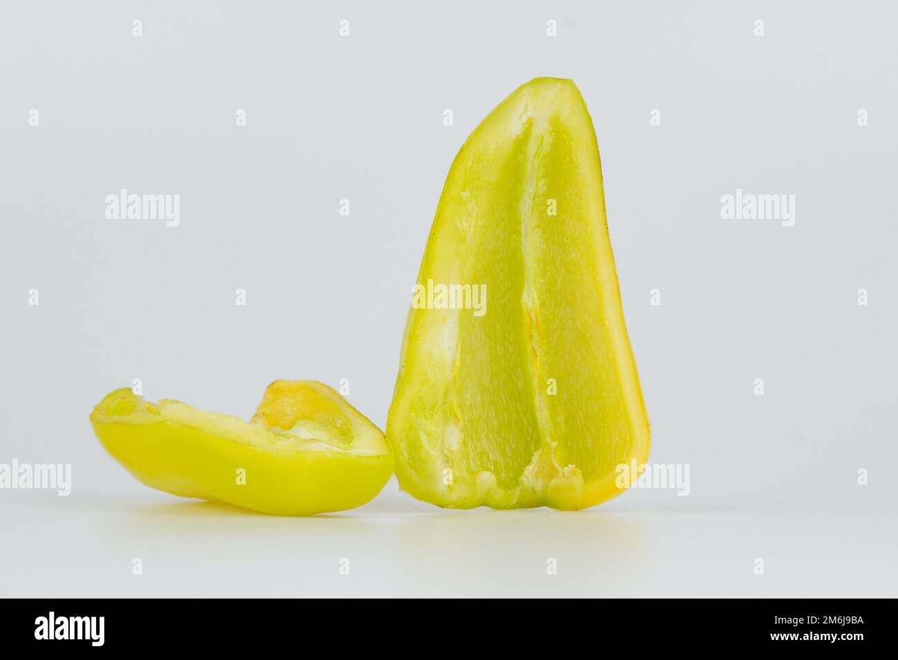 Sliced green sweet pepper isolated on white background. Cutting contour ...