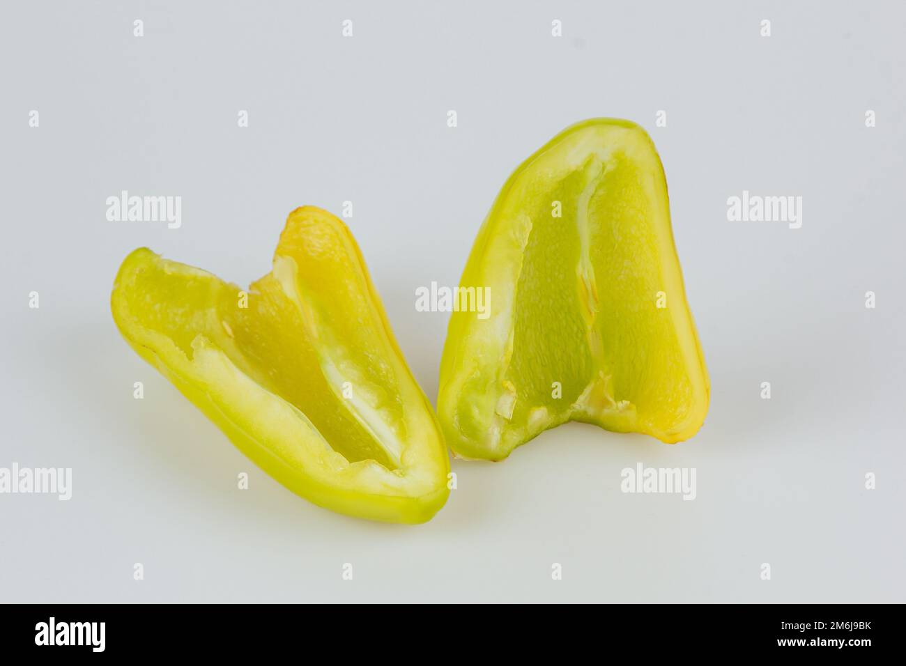 Sliced green sweet pepper isolated on white background. Cutting contour ...