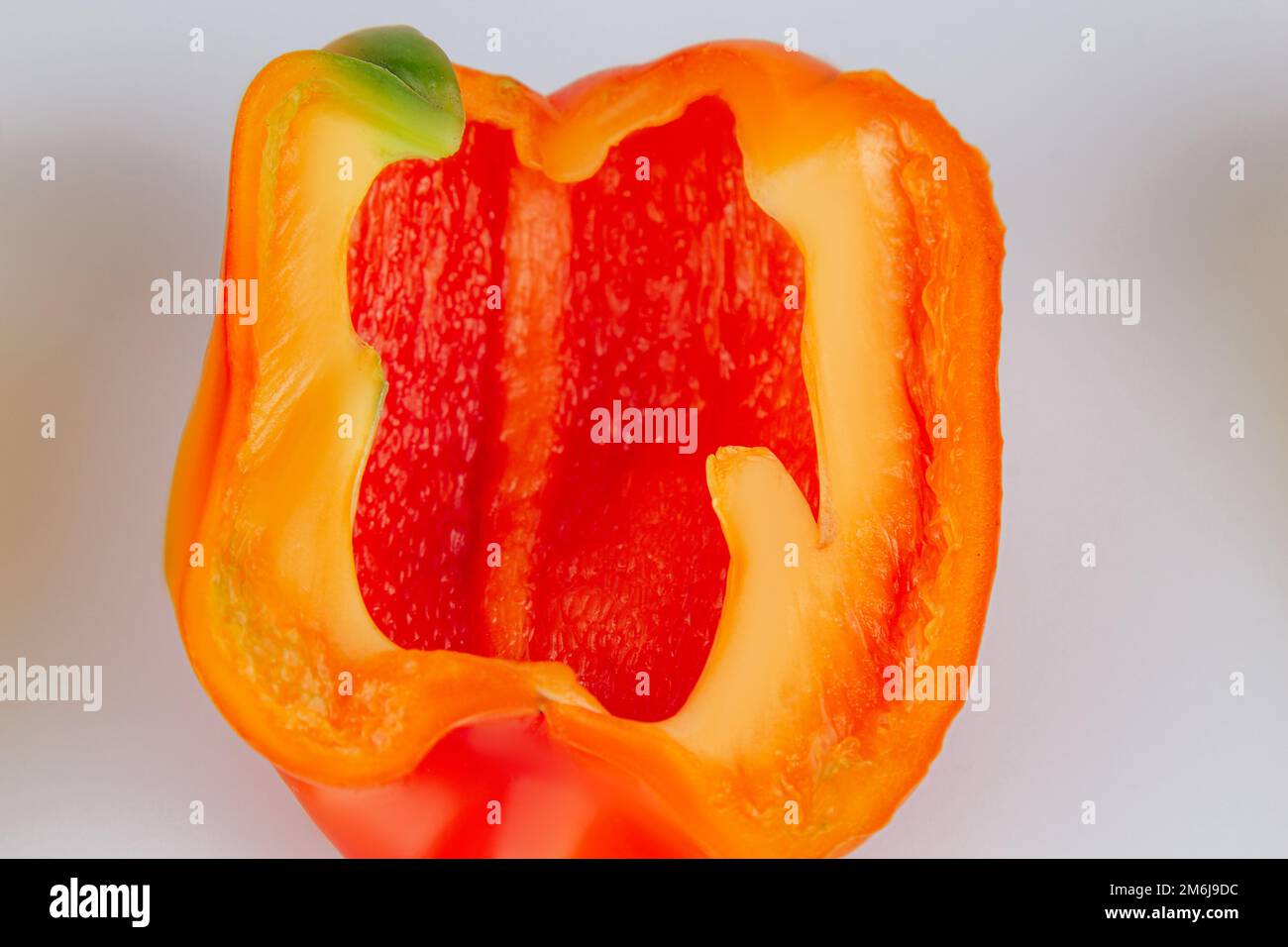 Sliced red sweet pepper isolated on white background. Cutting contour ...
