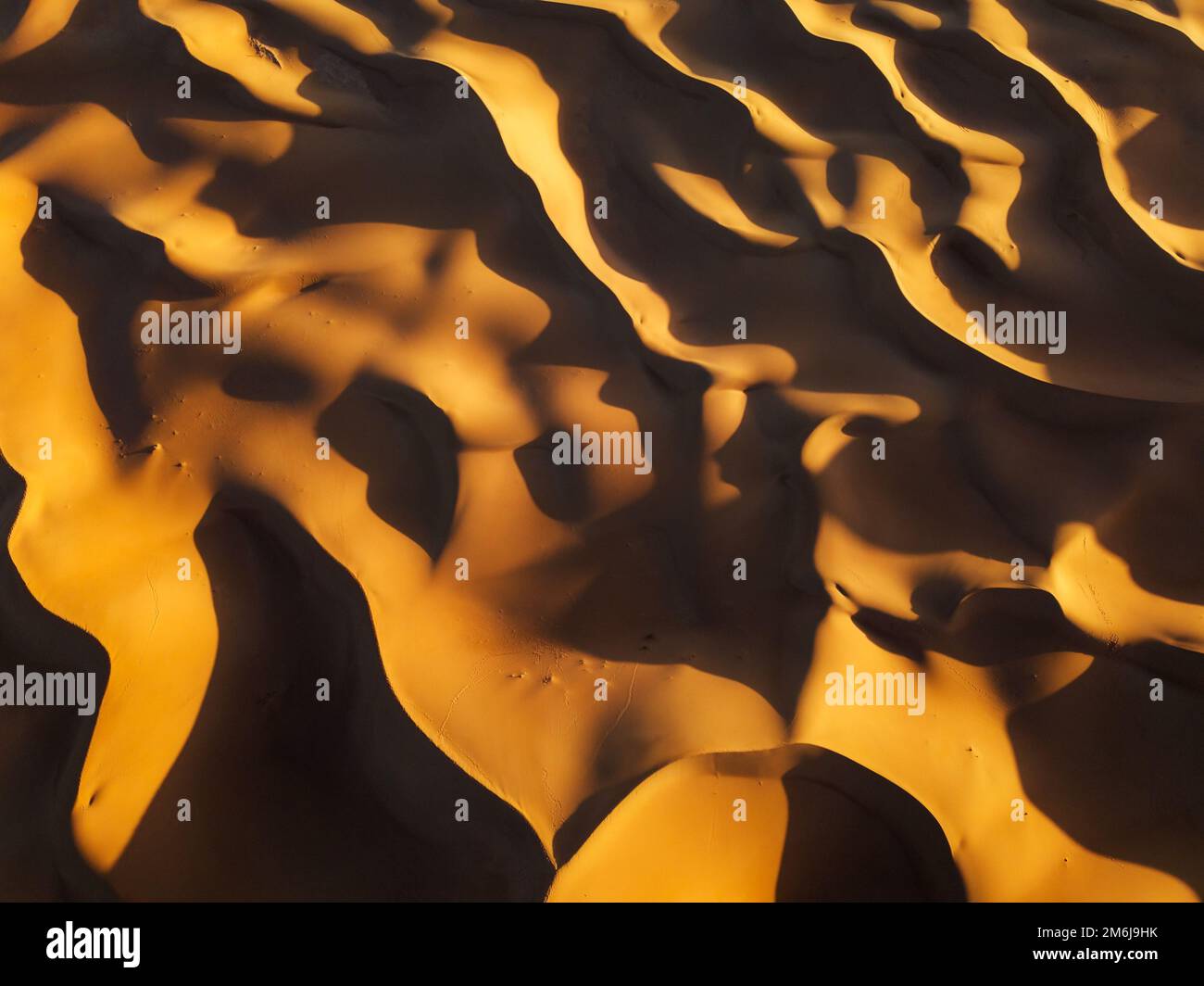 Aerial top view on sand dunes in desert Stock Photo - Alamy