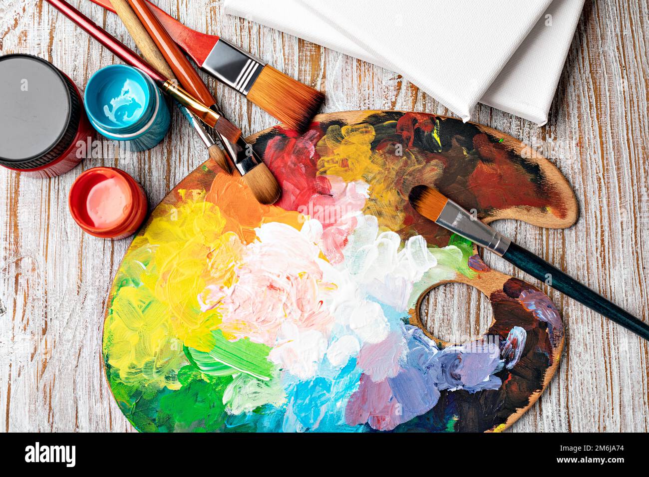 Art palette with colorful mixed paints Stock Photo - Alamy