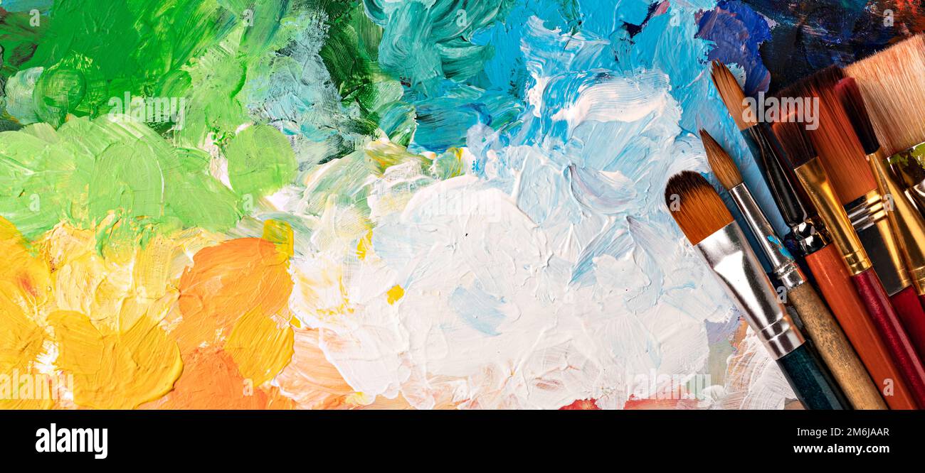 Art palette with colorful mixed paints Stock Photo - Alamy