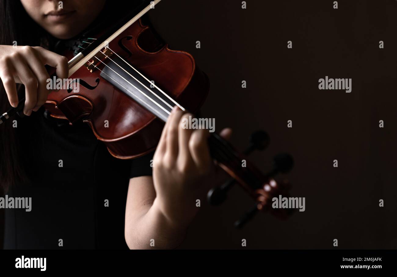 Teen playing violin in formal wear Stock Photo - Alamy