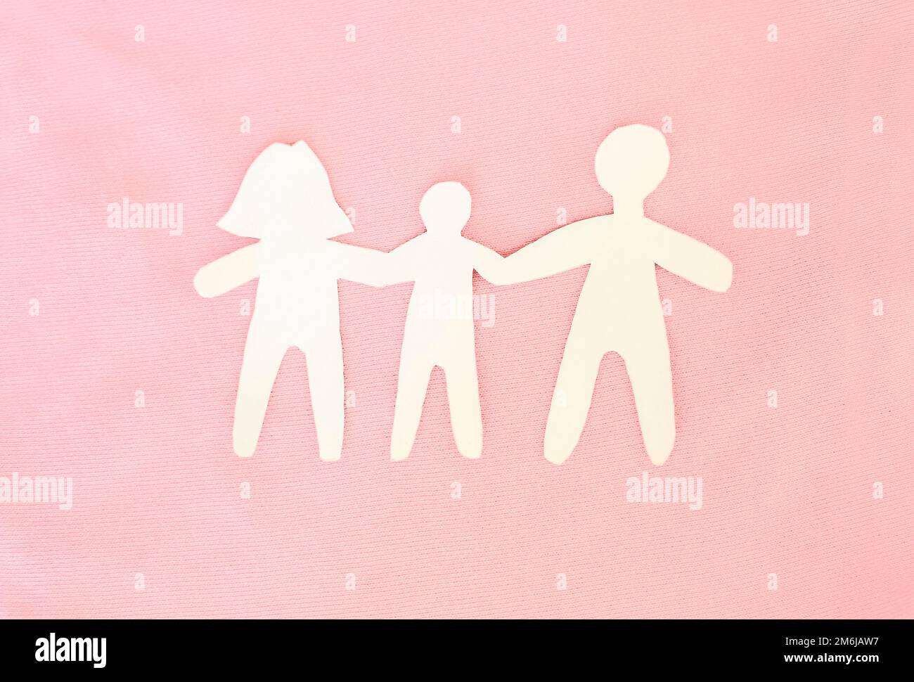 Stick figure family paper doll chain Stock Photo - Alamy