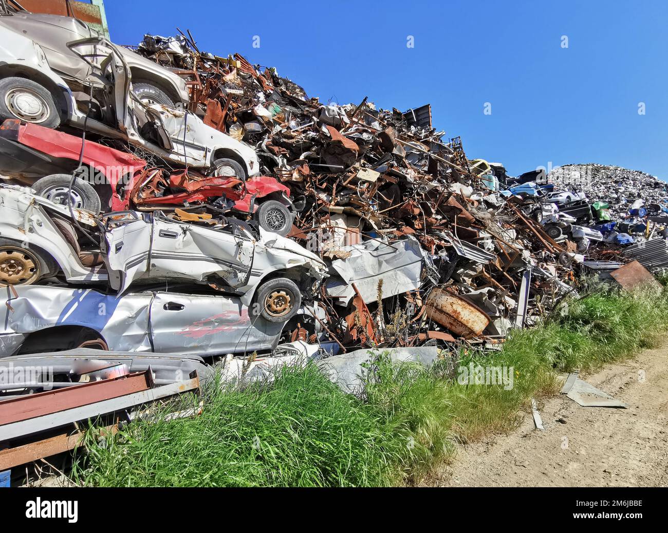 Pile of various scrap cars and other metals on a junk yard ready ...