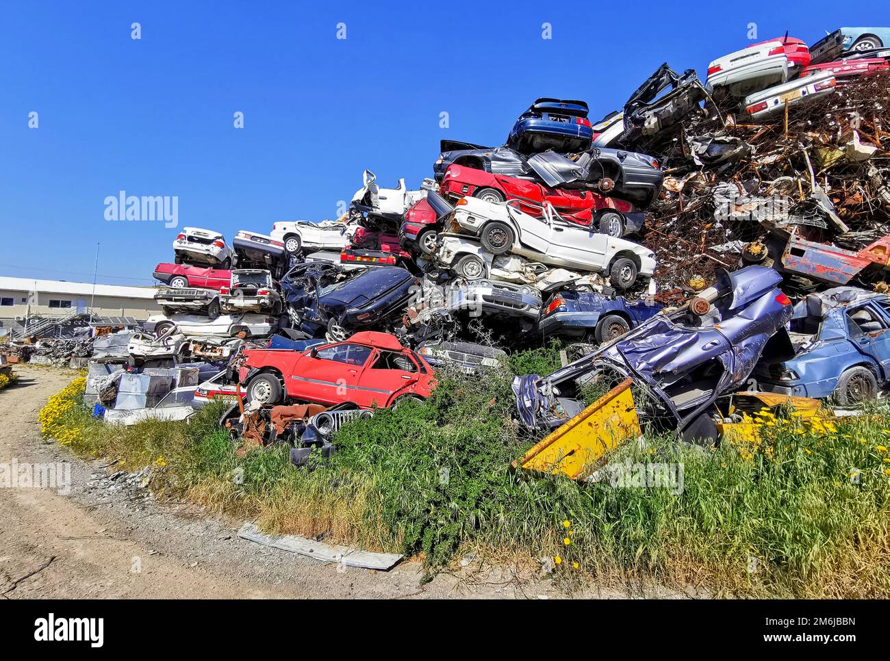Pile of various scrap cars and other metals on a junk yard ready ...