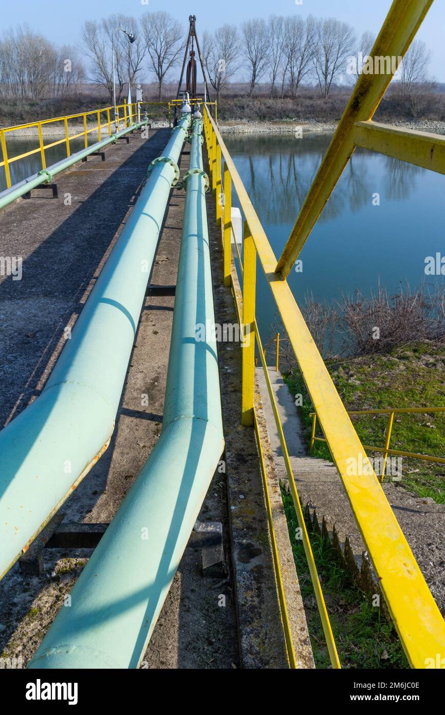 View of storage tank and pipes of chemical industry, Italy Stock Photo ...