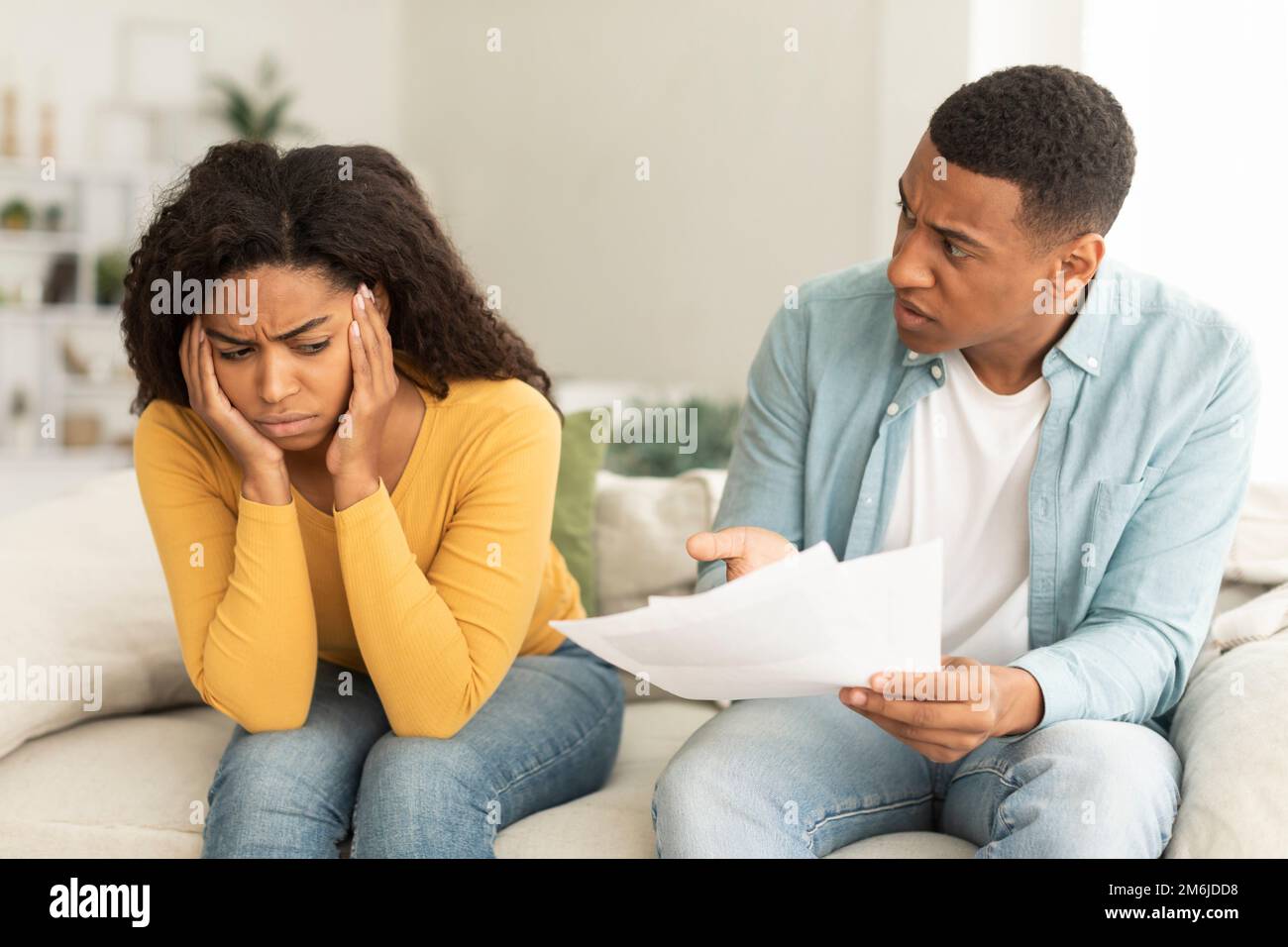 Angry Sad Millennial African American Man With Papers Swearing Woman