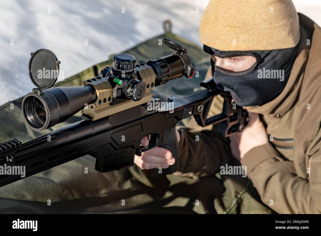 Holding a sniper rifle hi-res stock photography and images - Alamy
