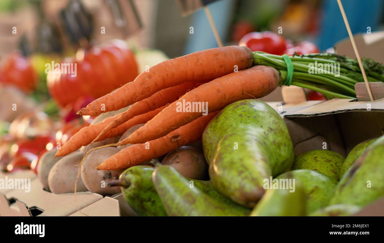 Boxes filled with seasonal fruits and veggies placed on counter, fresh ...