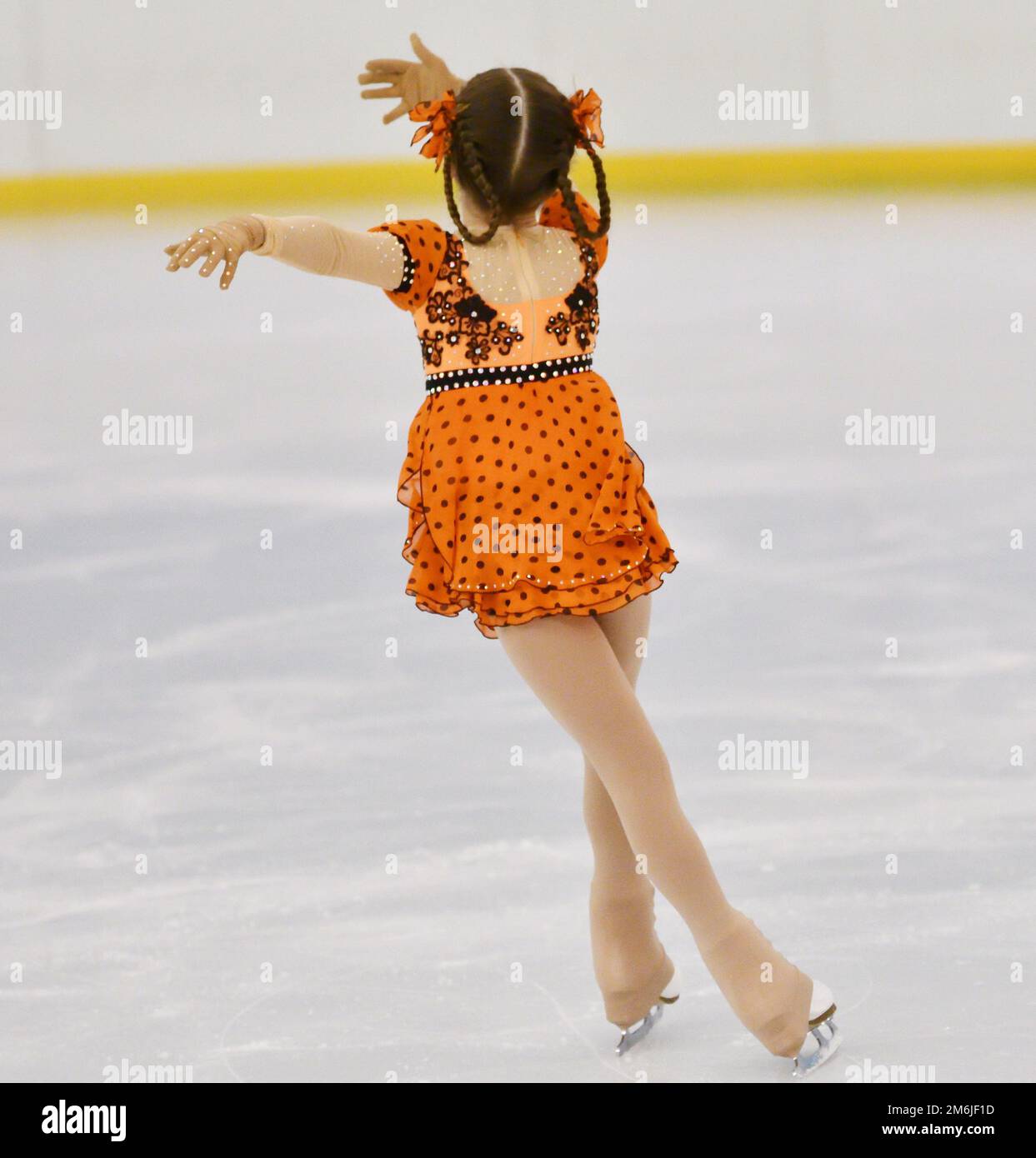 Girl figure skating rolls on a skating rink with artificial ice Stock ...