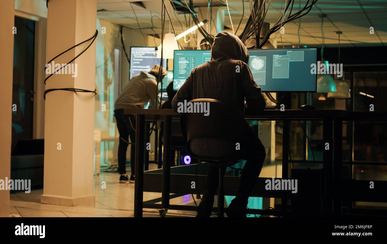 Woman Hacker Planning Phishing And Espionage At Night Trying To Break Server Firewall For