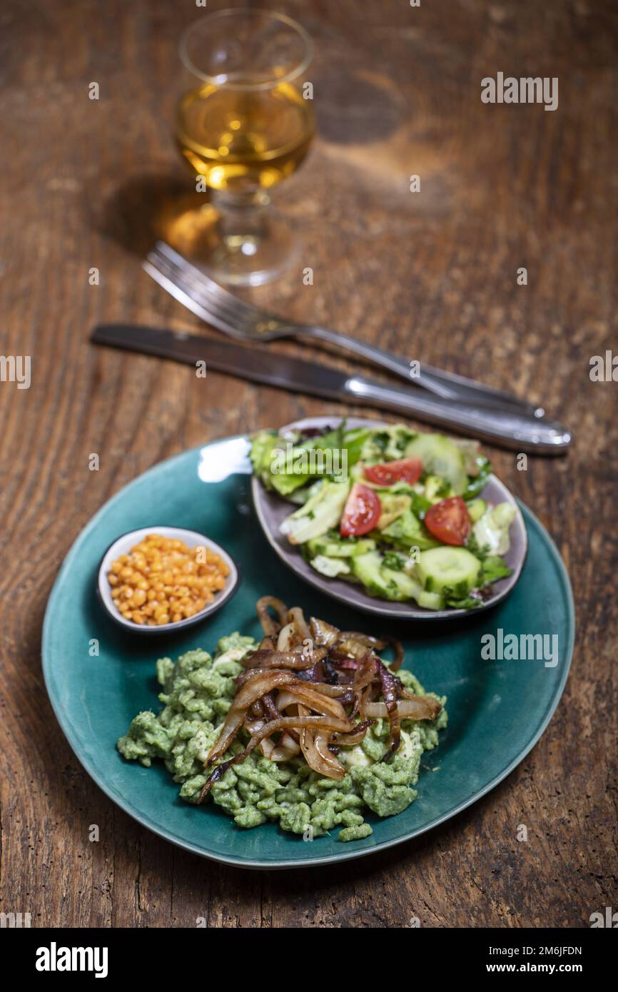 Bavarian spinach spaetzle on wood Stock Photo - Alamy