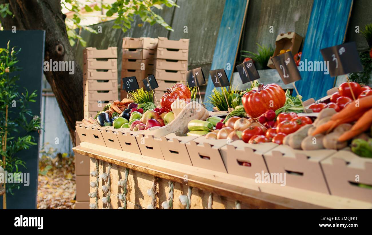 Local fresh produce at farmers market display stand with organic ...