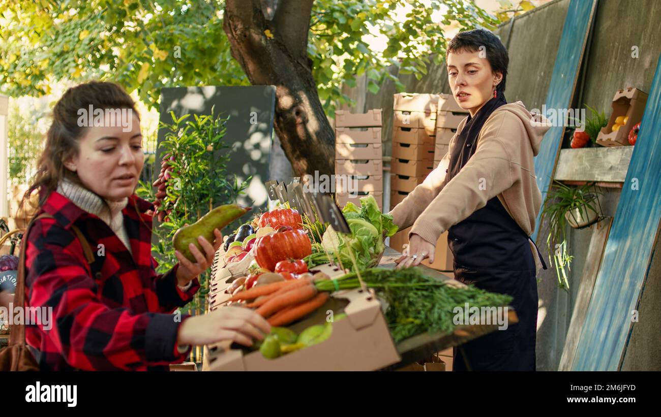 Female young seller showing eco healthy organic products from own ...