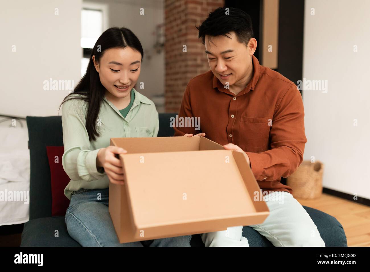 Mature woman opening package hi-res stock photography and images - Alamy