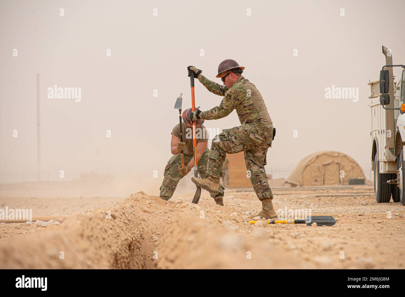 U.S. Air Force Master Sgt. Matthew Dry, front, the cable and antenna ...