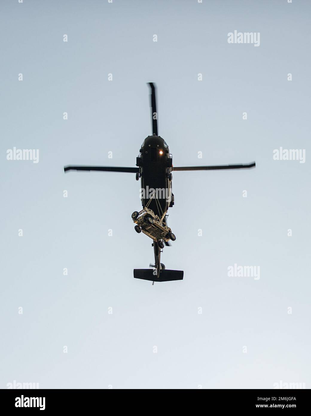 A UH-60 helicopter delivers an all-terrain vehicle to a modular urban ...