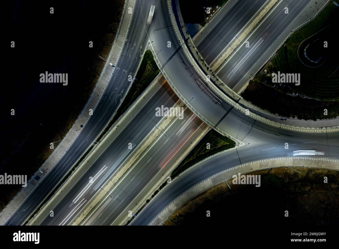 Aerial drone view of highway junction. Roundabout cars moving fast ...