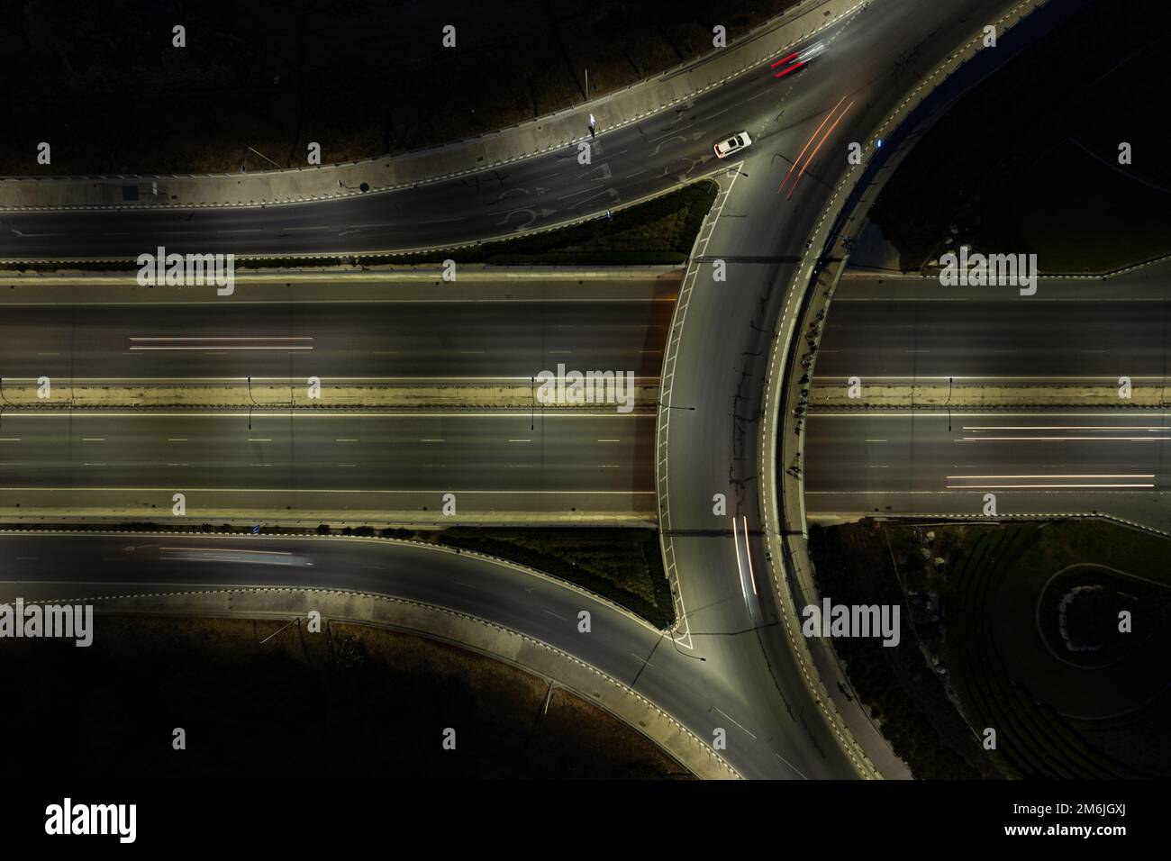 Aerial drone view of highway junction. Roundabout cars moving fast ...