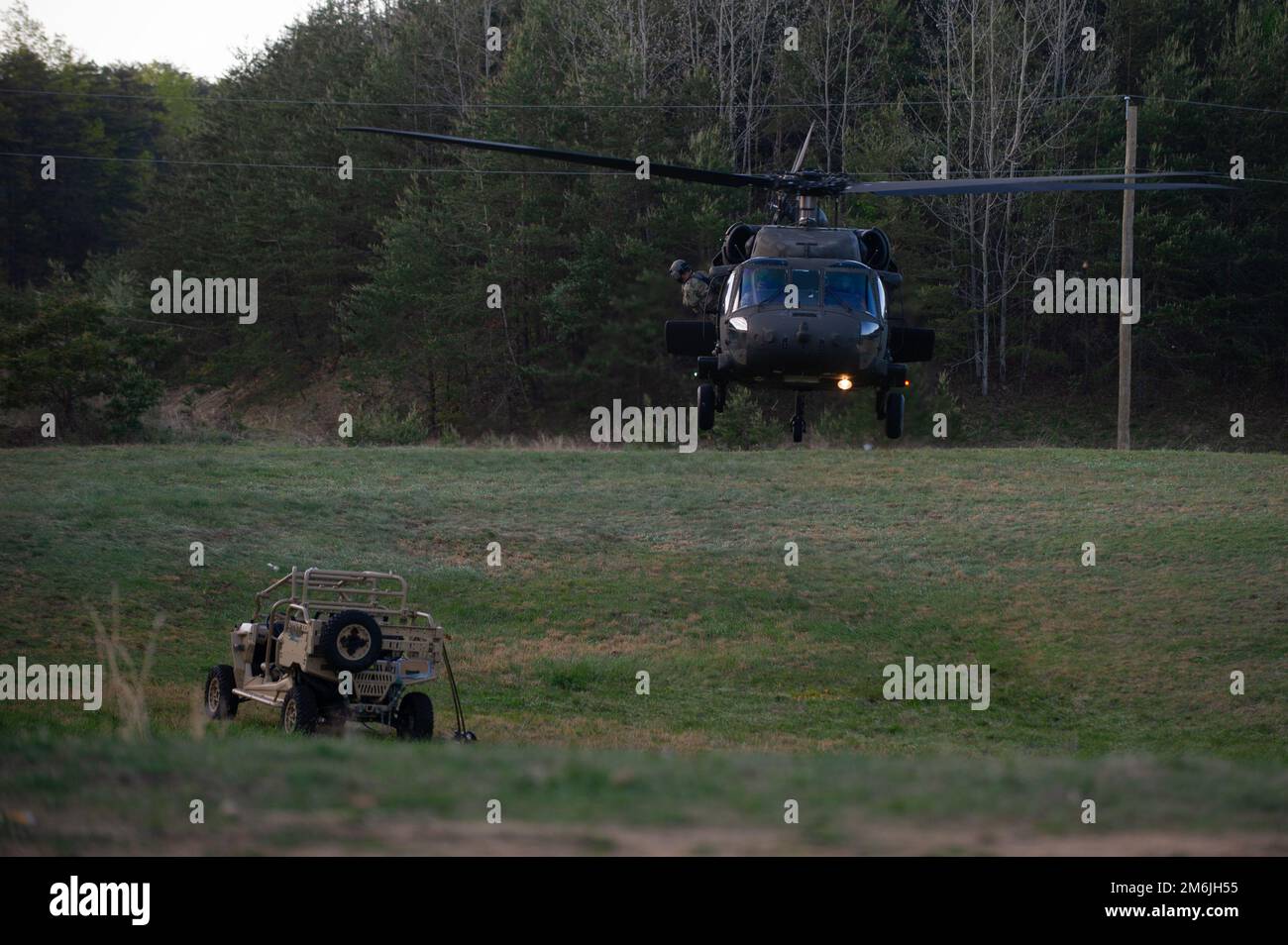 A UH-60 helicopter delivers an all-terrain vehicle to a modular urban ...