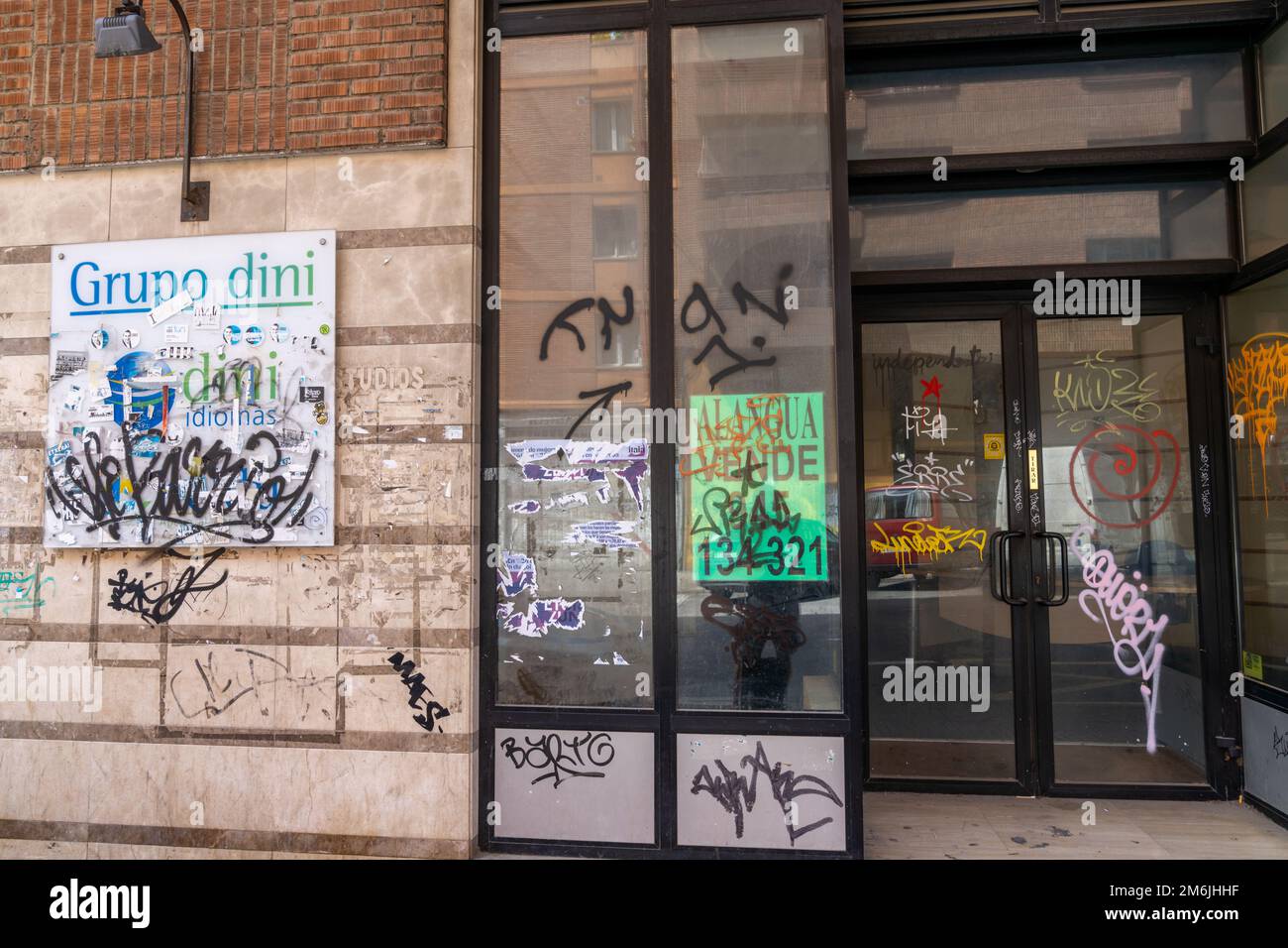 Close-up view of a building with graffiti and destruction from ...