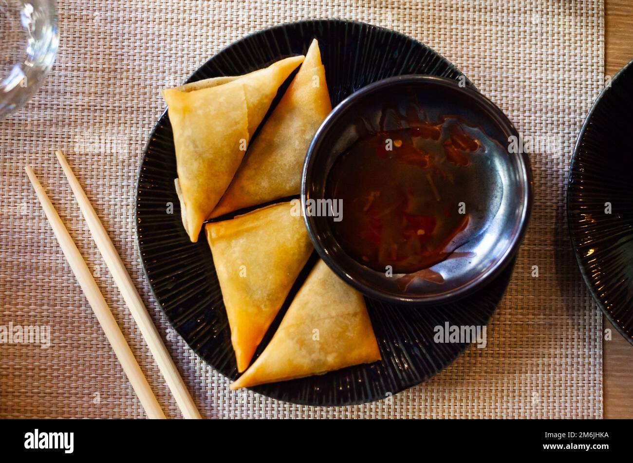 Potato curry samosas served with sause at plate Stock Photo - Alamy