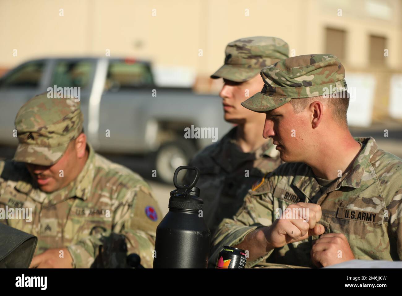 From left, U.S. Army Sgt. Roy Price, tank gunner, Spc. Diego Santiago ...