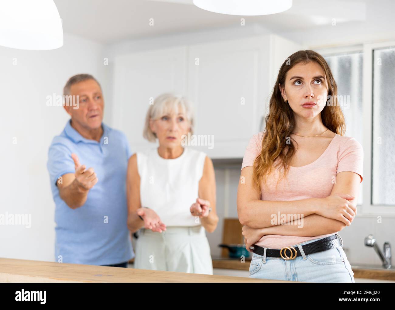 Parents lecturing daughter Stock Photo - Alamy