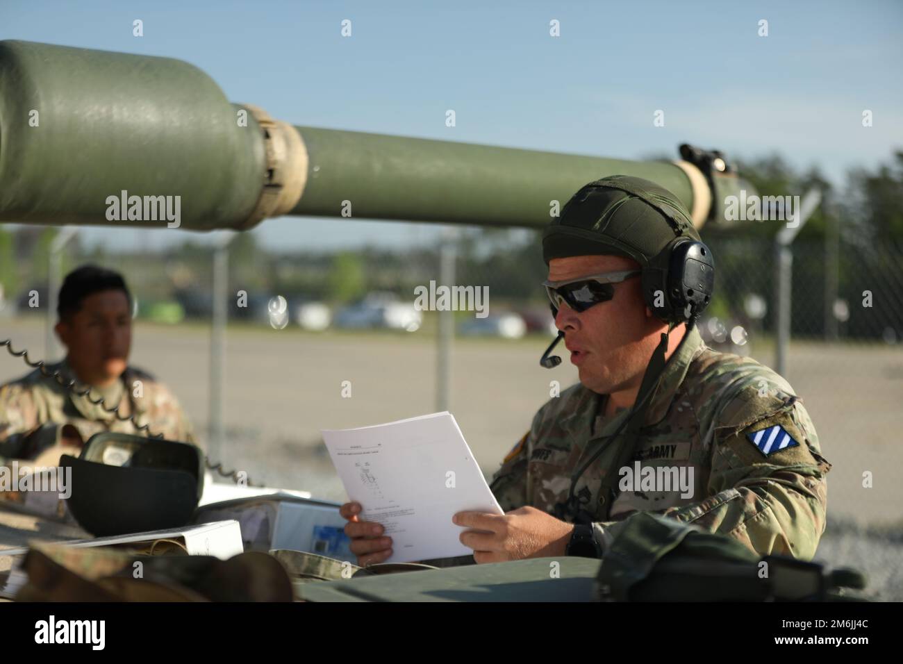 From left, U.S. Army Spc. Alejandro Anguiano, tank loader and Staff Sgt ...