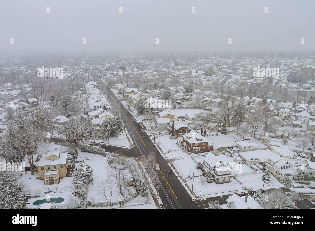 Aerial view of snowfall after severe winter American small town in ...