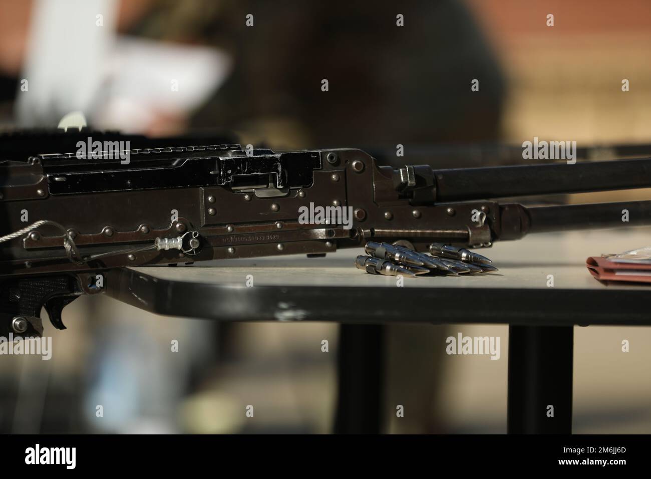 An M240 machine gun and training rounds sit on a table during day 4 ...