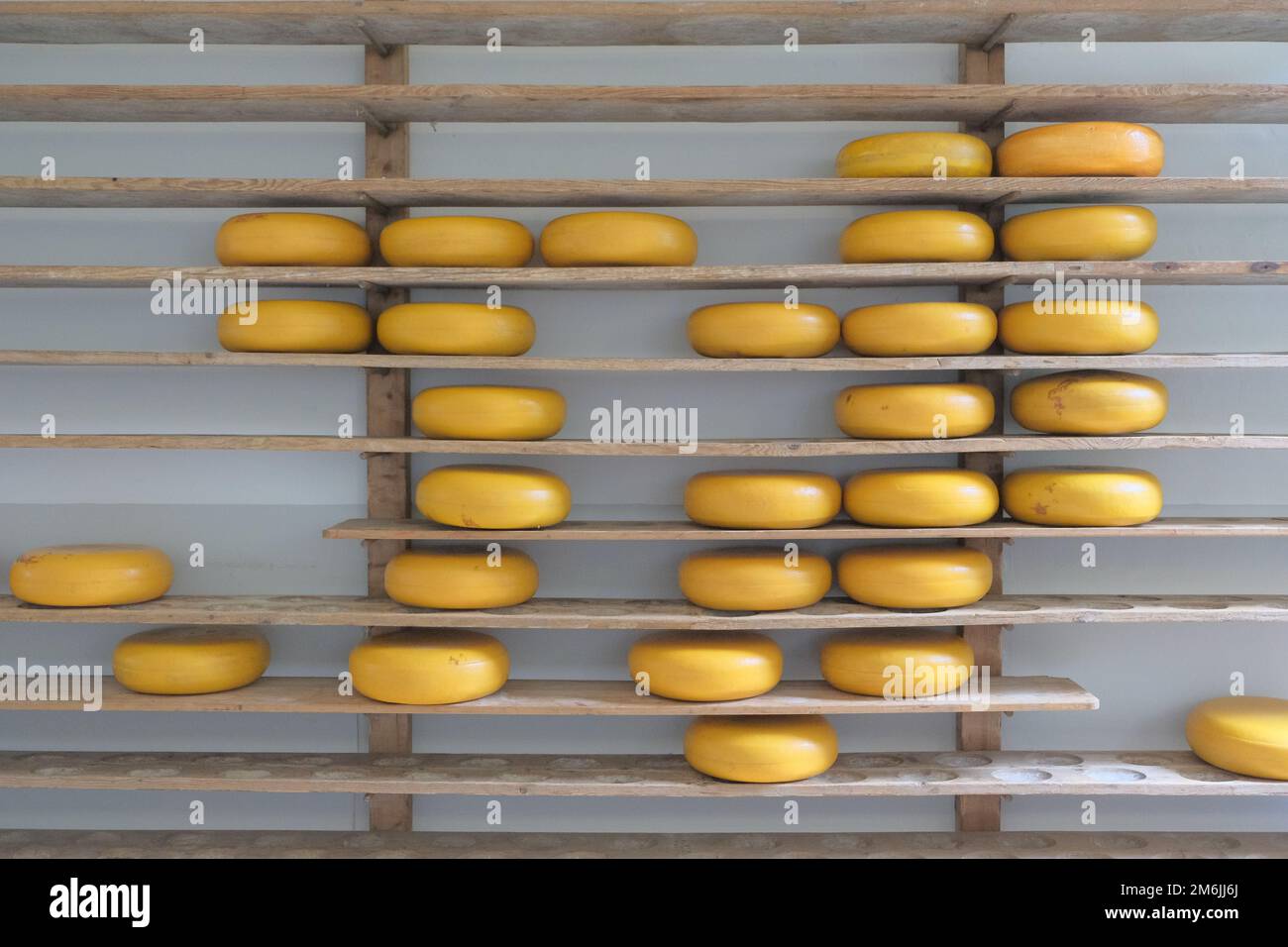 Cheese aging in an old dutch cheese factory Stock Photo - Alamy