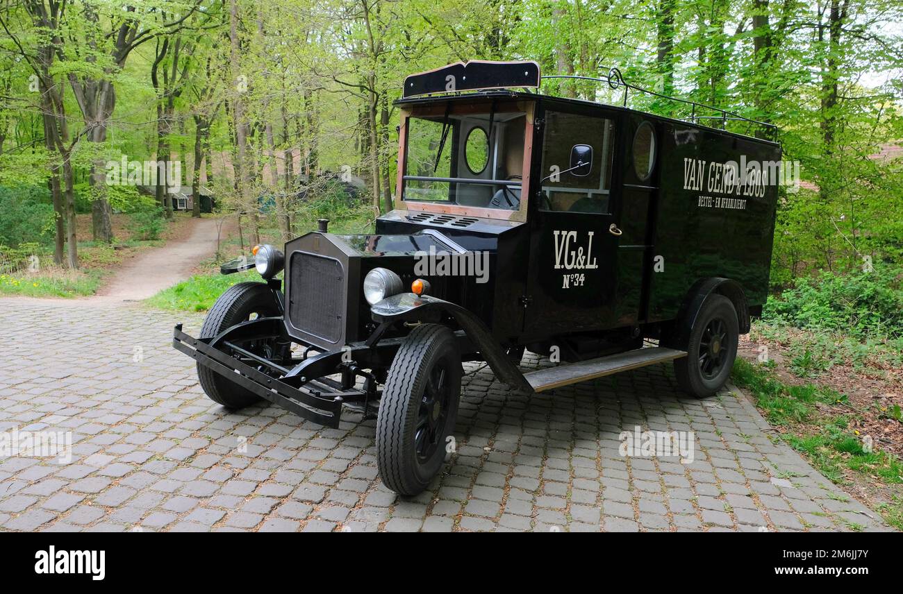 Oldtimer transport bus standing in the woods Stock Photo - Alamy