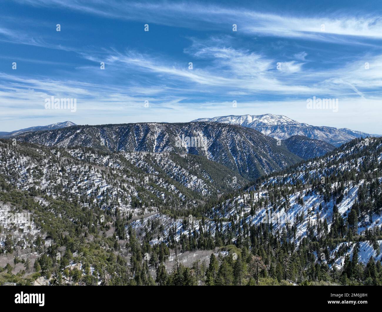 Aerial view over Big Bear Valey and Lake with now, South California ...