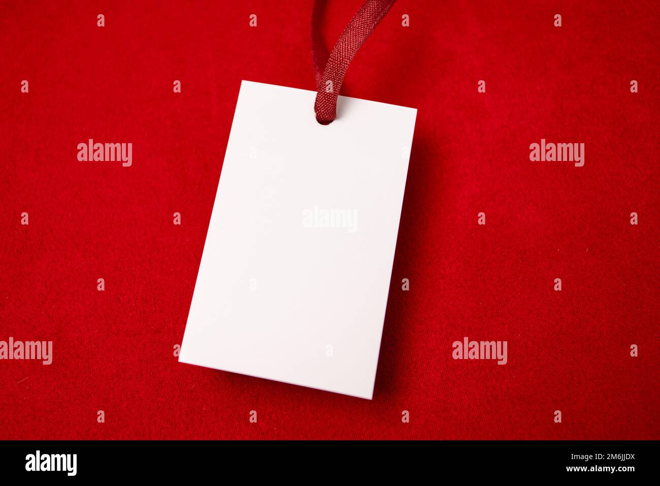 Modern advertising for cloth design. Clothes tag mock up white on red ...