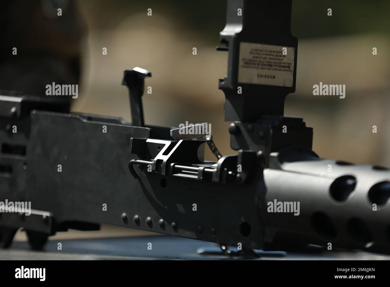 A headspace and timing gauge rests in an M2 .50 caliber machine gun ...