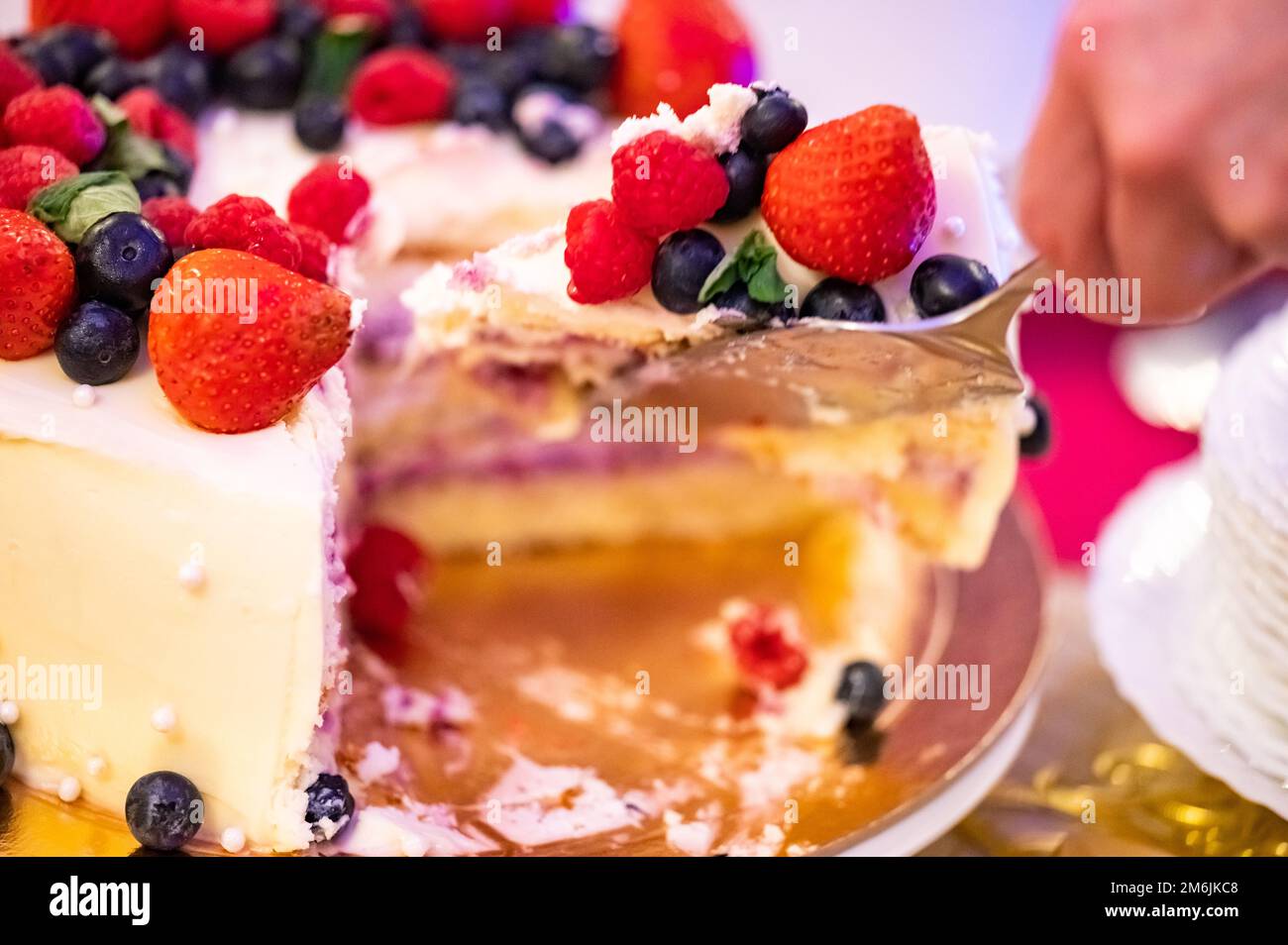 Woman decorating birthday cake hi-res stock photography and images - Alamy