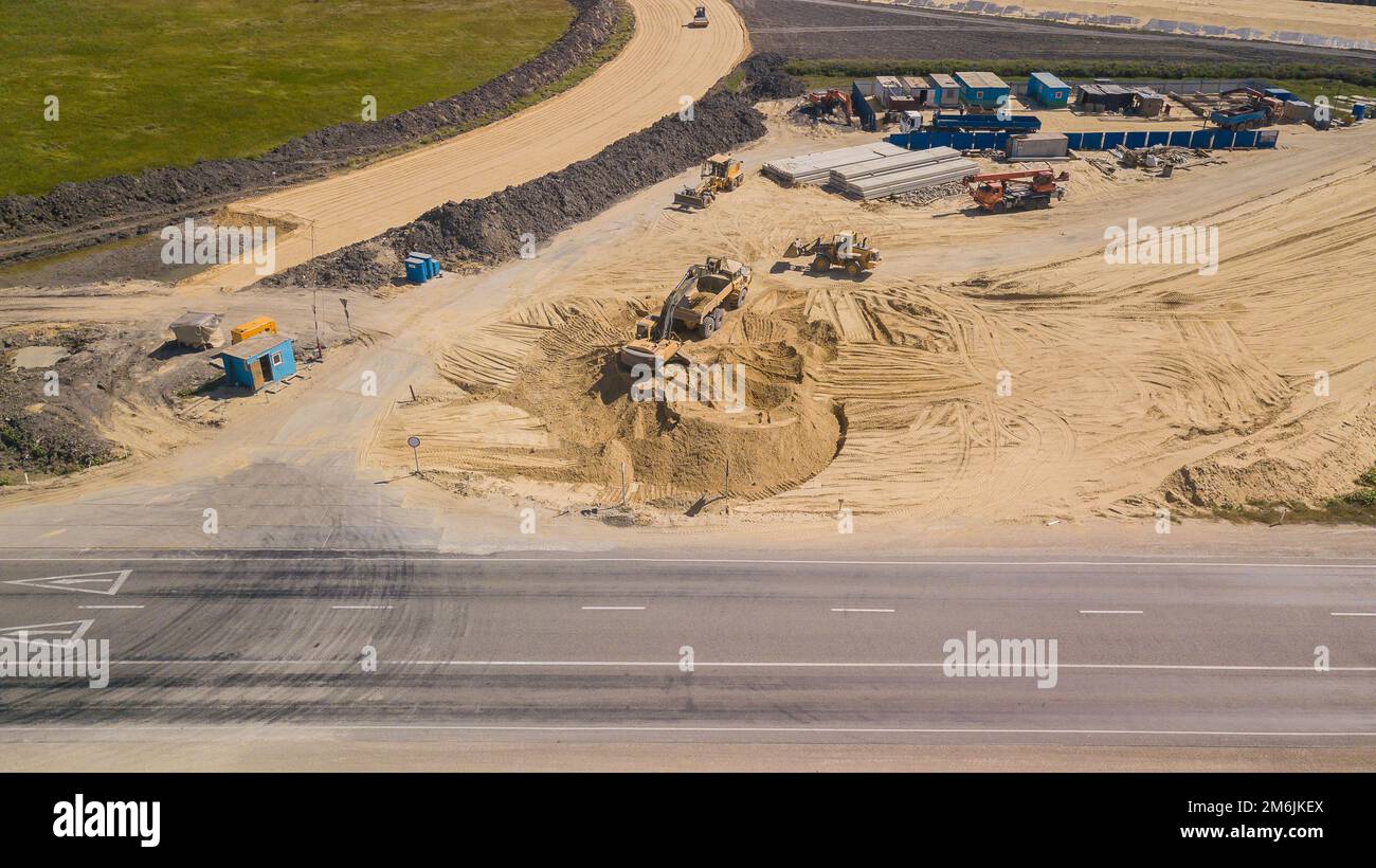 Excavator Is Loading Ground Into Truck On Construction Of Traffic ...