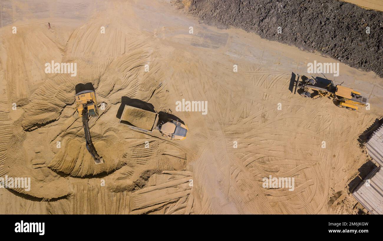 Top view of excavator working in construction site Stock Photo - Alamy
