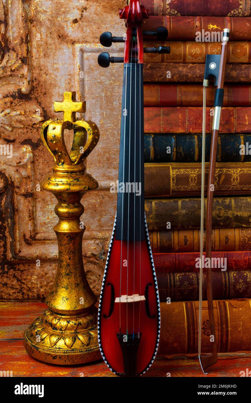 Pocket Violin And Old Books Still Life Stock Photo - Alamy